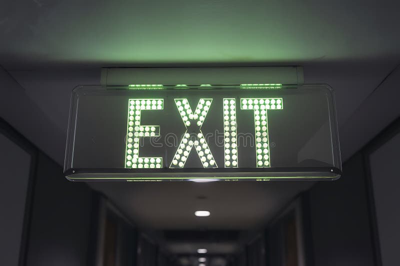 Illuminated Exit Sign in a Dark Corridor Stock Illustration ...