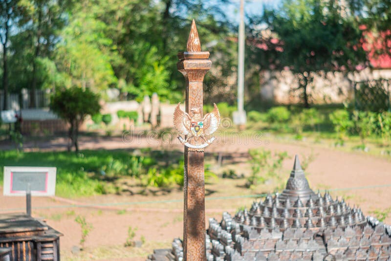 An Image Showcases a Tall, Multi-level Tower with Intricate Patterns ...