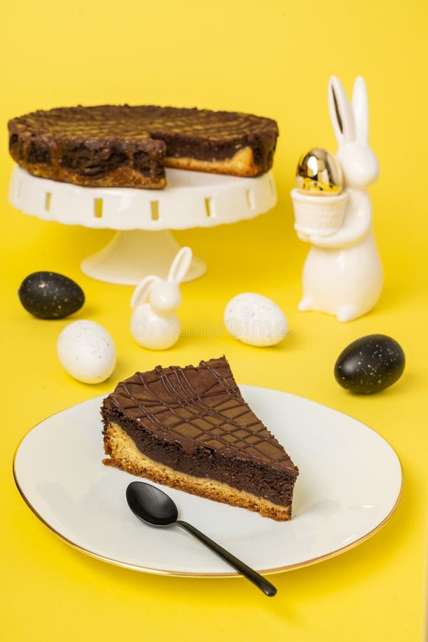 Traditional Easter Chocolate Cake on Yellow with Easter Decoration and ...