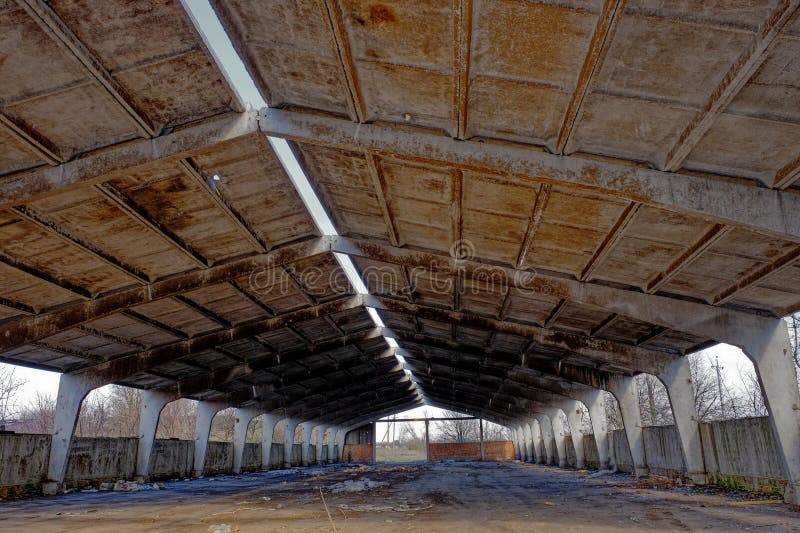 The Image Shows an Abandoned, Dilapidated Structure with a Series of ...