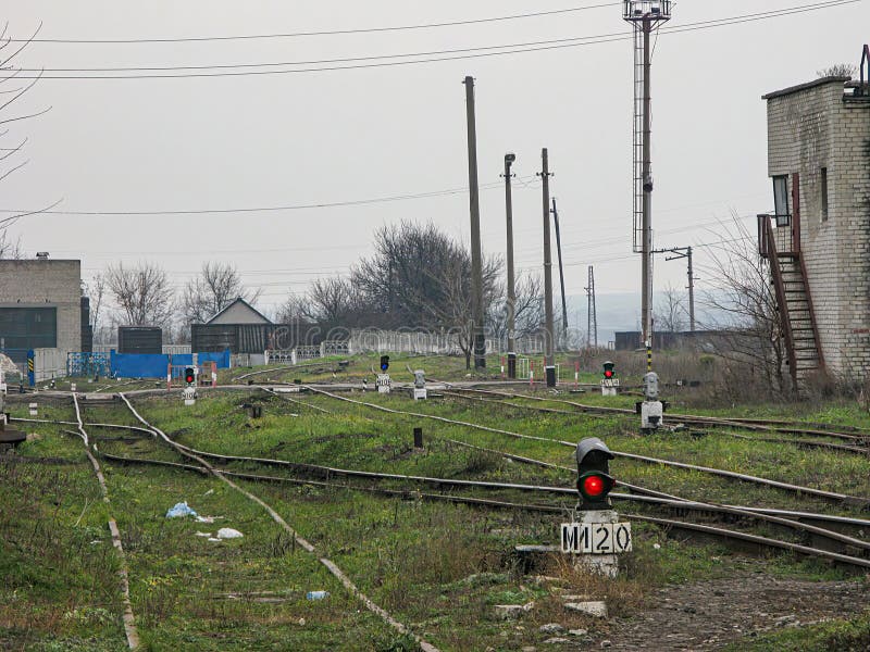 Image Shows an Abandoned Railway Intersection with Overgrown Tracks and ...