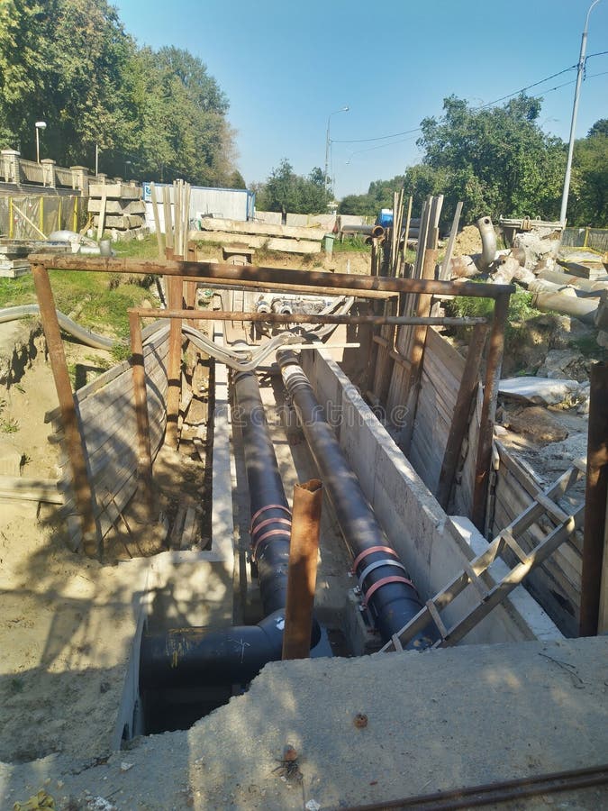 Underground Utility Installation: Active Construction Site with Large ...