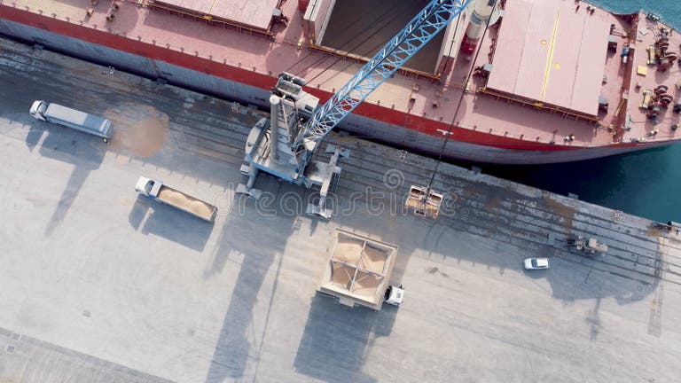 Aerial View of a Dockyard. a Large Cargo Ship is Docked at the Port ...