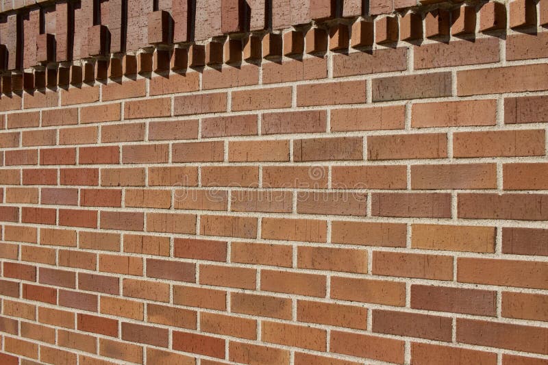 Brown Brick Wall Texture Background with Header of Protruding Bricks in ...