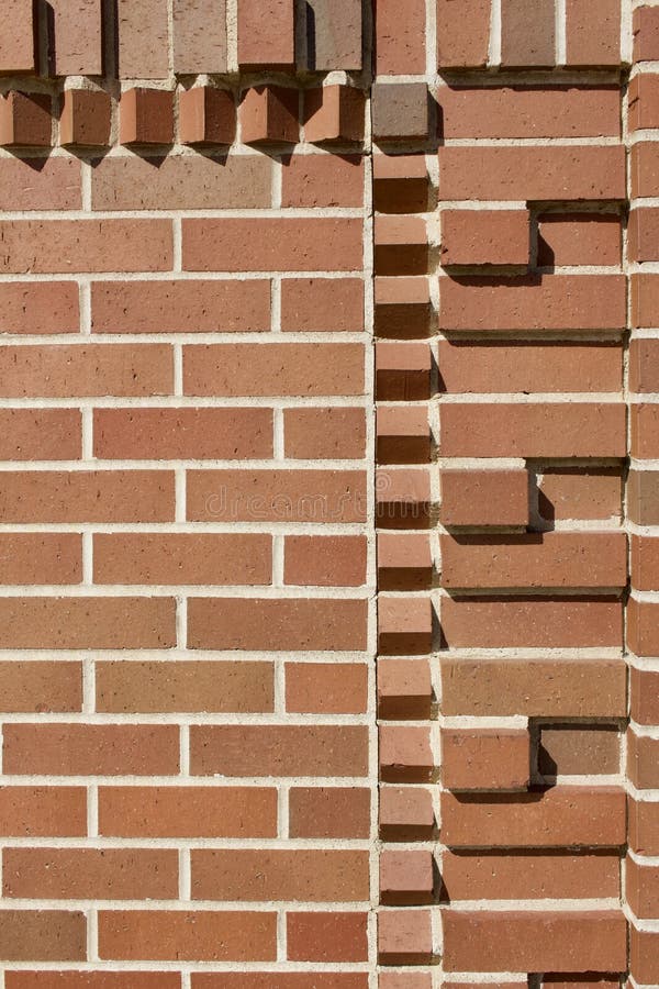 Brown Brick Wall Texture Background with Header of Protruding Bricks in ...