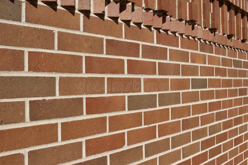 Brown Brick Wall Texture Background with Header of Protruding Bricks in ...
