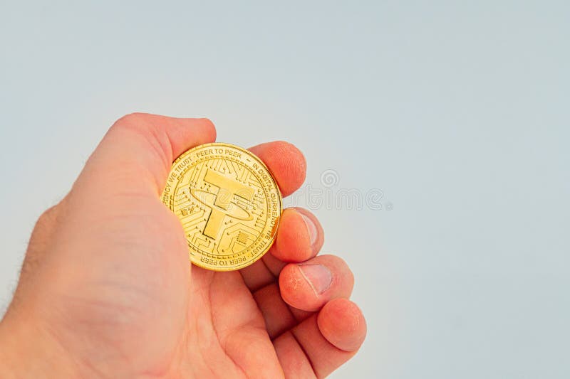 Image Shows a Close-up of a Hand Holding a Physical Tether Coin Coin ...