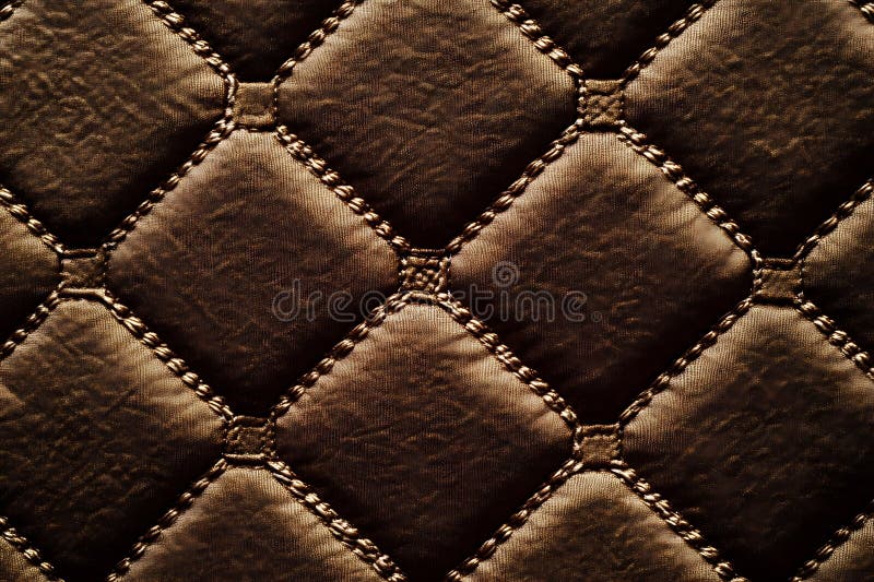The Image Shows a Close-up of a Quilted, Diamond-patterned Brown ...