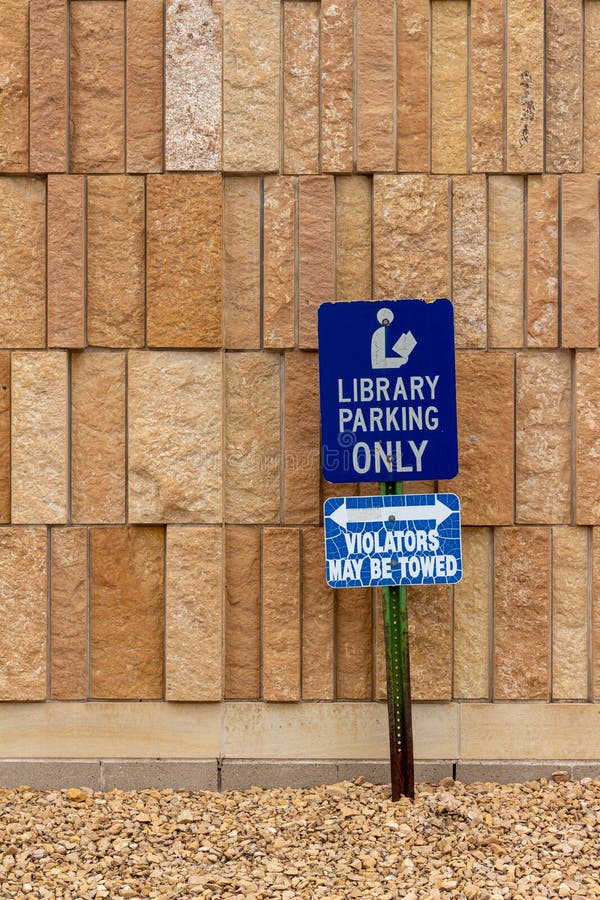 View of a Library Parking Sign in Front of an Modern Limestone Wall ...