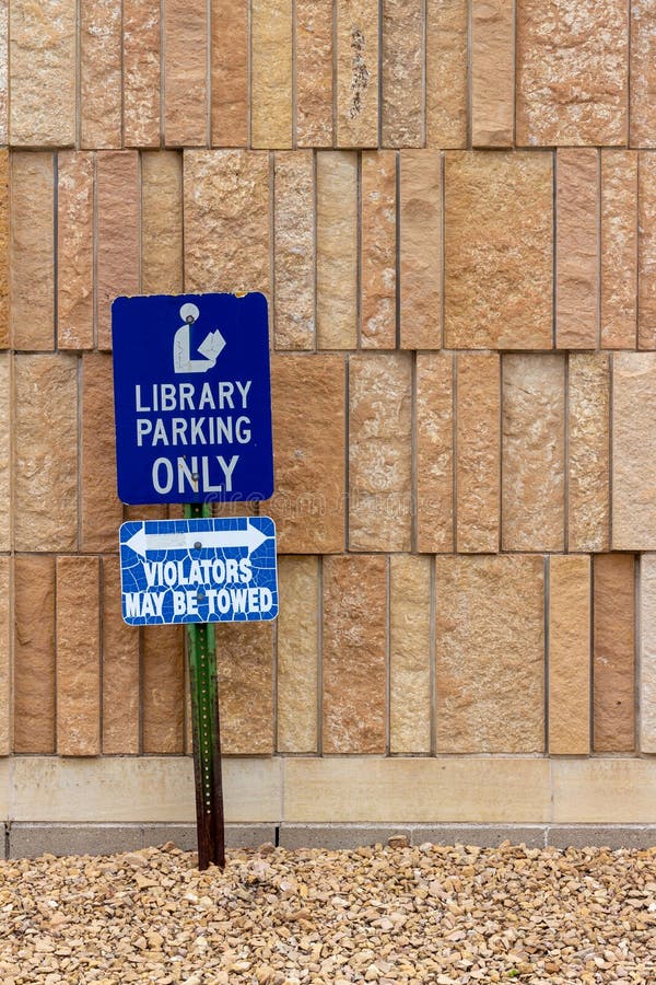 View of a Library Parking Sign in Front of an Modern Limestone Wall ...