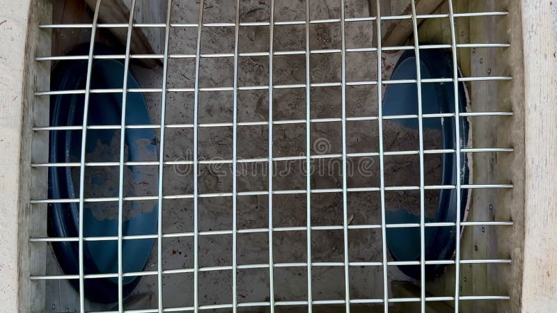 A Durable Industrial Drainage Grate Featuring Distinctive Blue Inlets ...