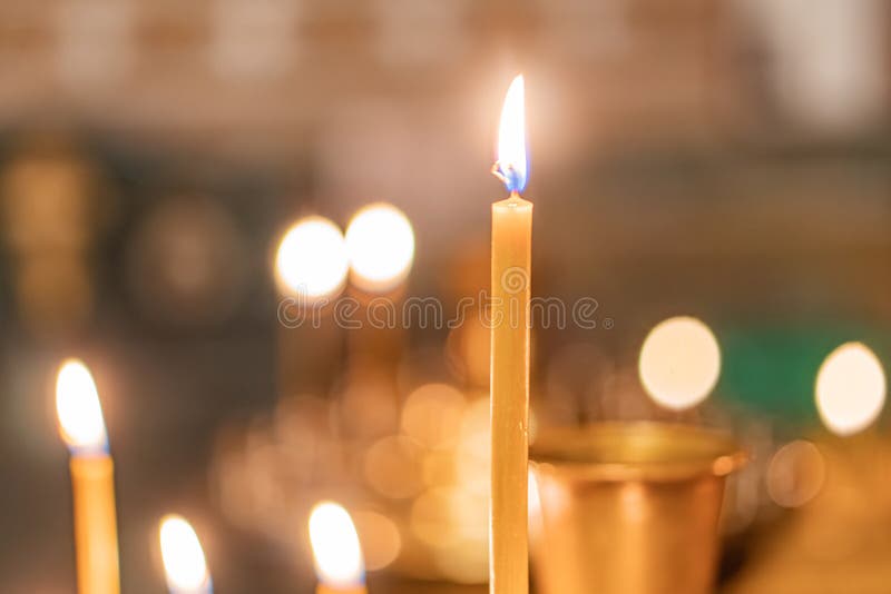 Image Shows a Collection of Lit Candles with Varying Heights and Sizes ...