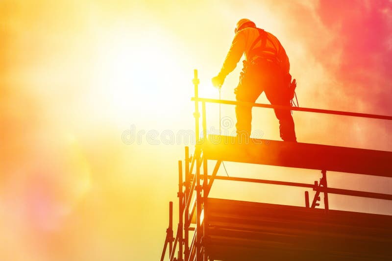 Silhouette Construction Worker Scaffolding Against Vibrant Orange ...