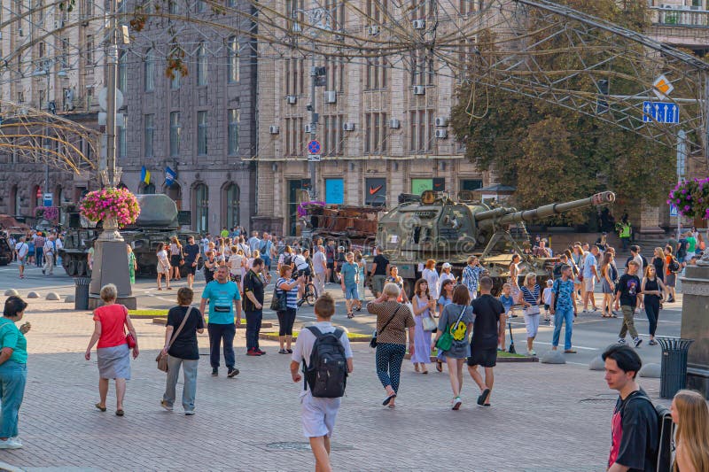 Image Shows a Crowd Gathering Around a Military Tank Display in a ...