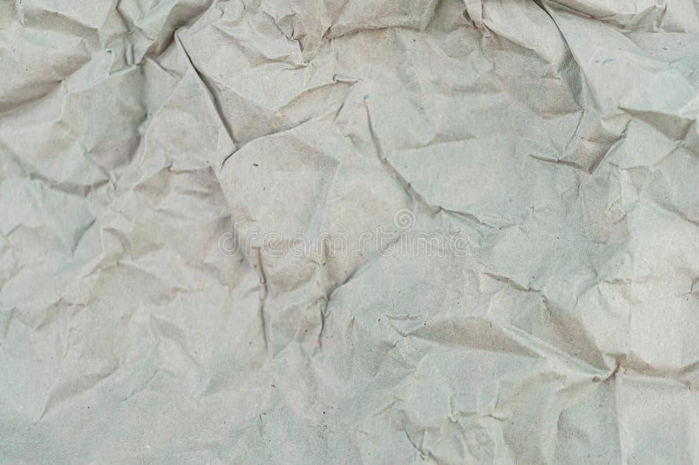 The Image Shows a Crumpled, Textured Paper Symbolizing Challenges and ...