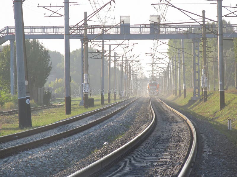 Image Shows a Curving Railway Track with Converging Rails, Featuring a ...