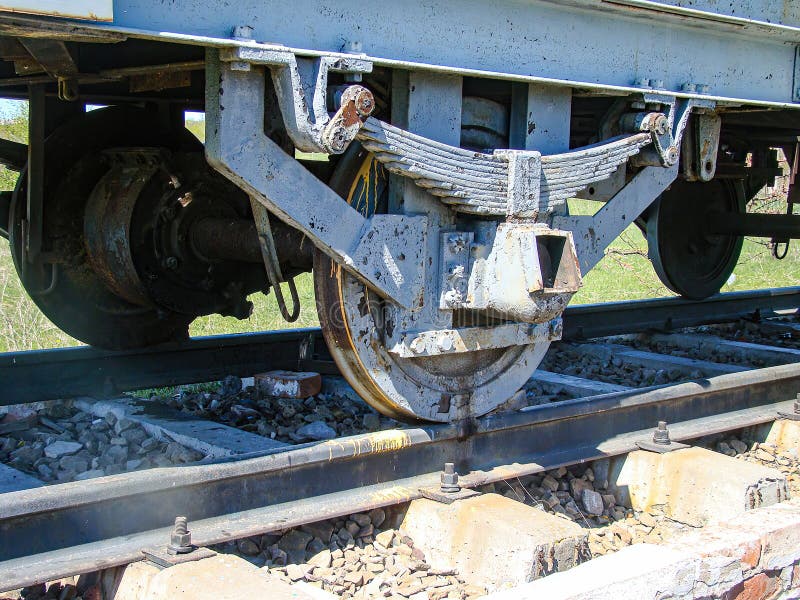The Image Shows an Idle Train Cars Mechanical Underside with Coupling ...