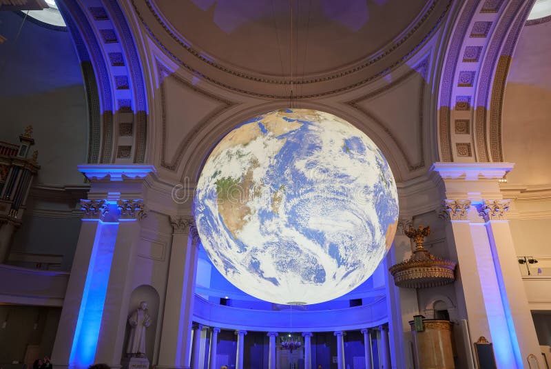 A Grand Building with Hardwood Floors, Columns, Arches, and Symmetrical ...