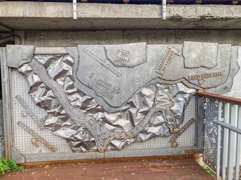 The Image Shows a Large, Textured Metal Sculpture Resembling a Stylized ...