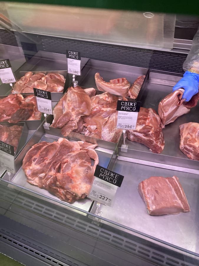 Image Shows a Meat Display Case in a Grocery Store, Filled with Pork ...