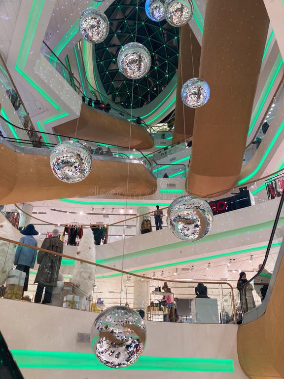 The Image Shows a Modern, Multi-level Shopping Mall or Store with a ...