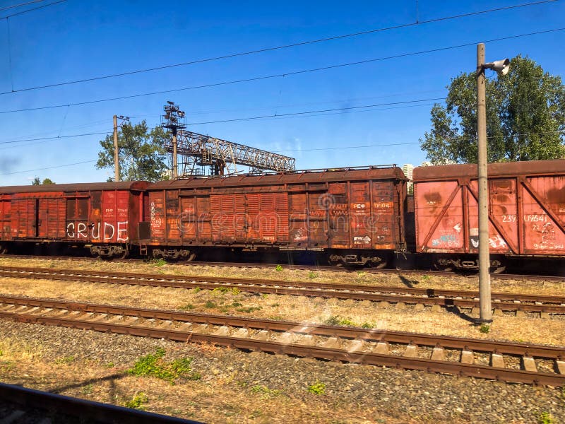 Image Shows an Old, Rusty Red Train Car Labeled WASHOUT 2075 on a ...