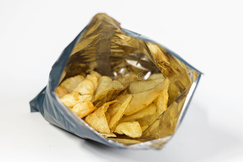 The Image Shows an Open Bag of Potato Chips Lying on a Light Surface ...