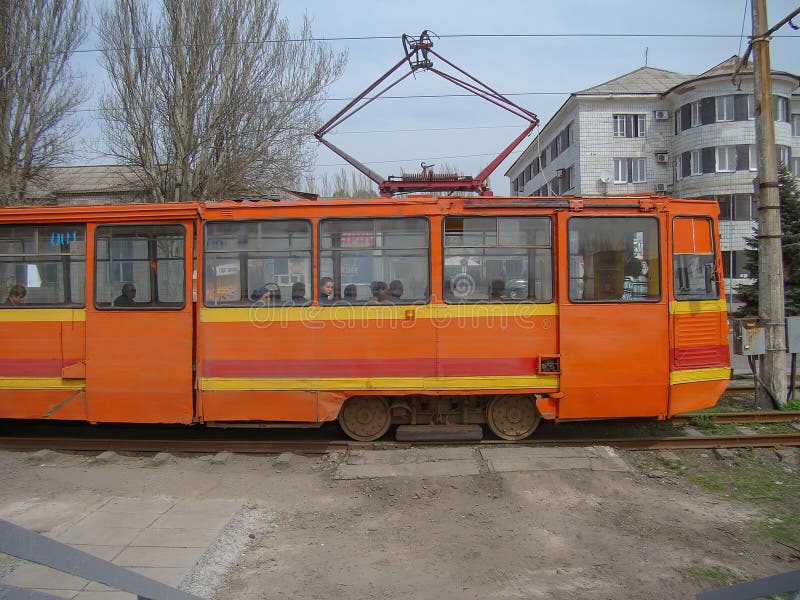 Image Shows an Orange-yellow Tram Stopped at a Station Platform, with ...