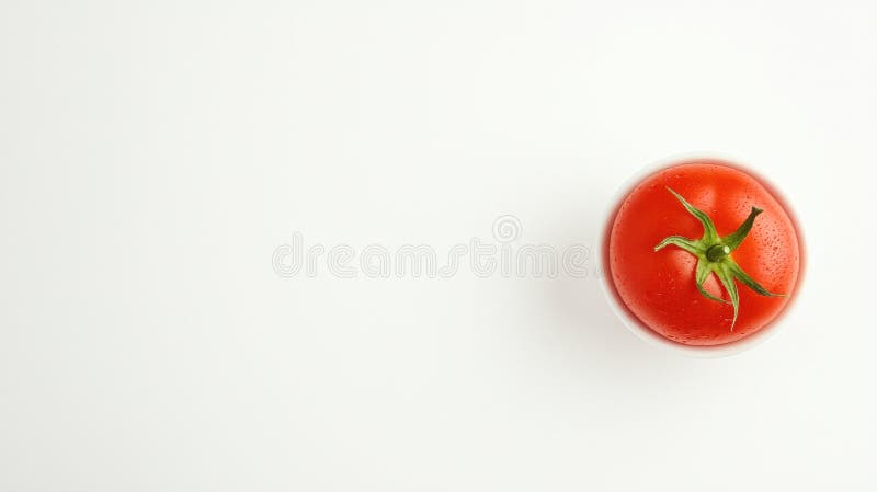 A Ripe Red Tomato with a Green Stem Sits in a White Bowl. Stock Image ...