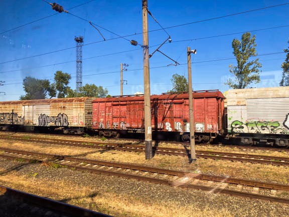 Image Shows a Train on Tracks, Possibly Captured from Another Moving ...