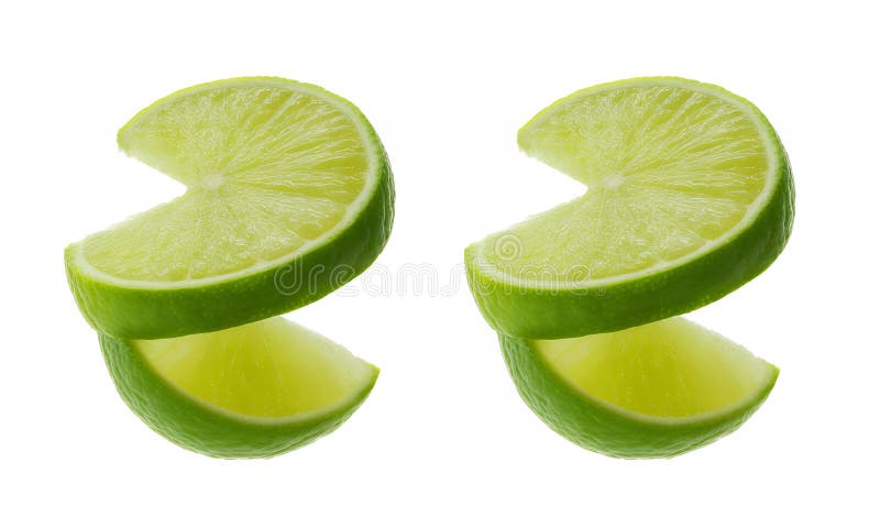 Two Vibrant Green Lime Slices with Pac-Man Cutouts Isolated Against a ...