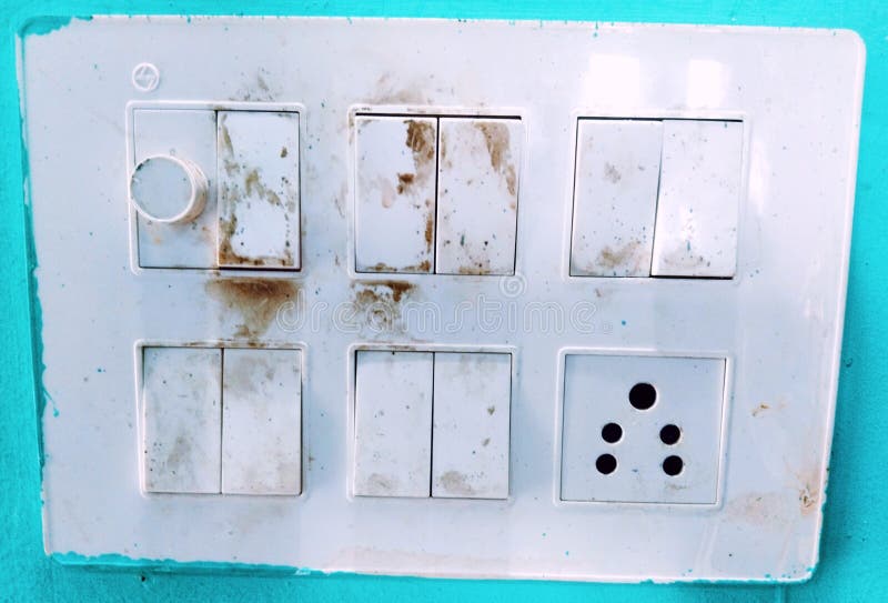 Dirty Electrical Switchboard on a Turquoise Wall. Stock Photo - Image ...