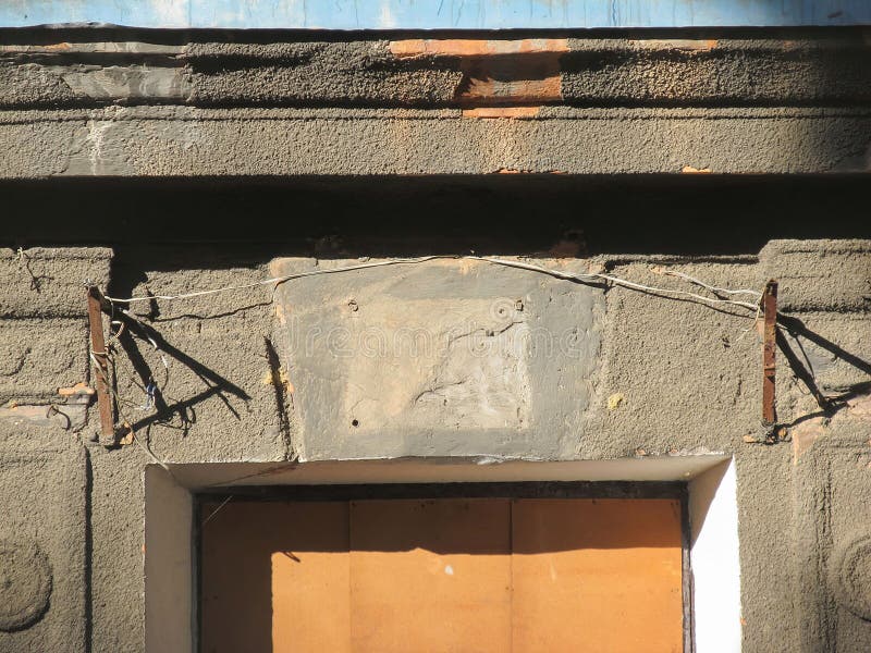 Image Shows a Worn, Old Building with a Boarded-up Window, Partially ...