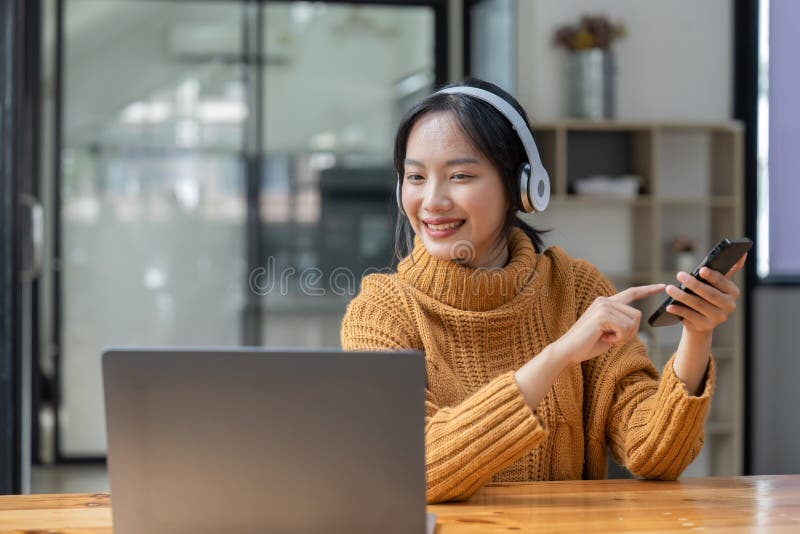 Image of Smiling Nice Woman Using Cellphone while Sitting at Home Stock ...