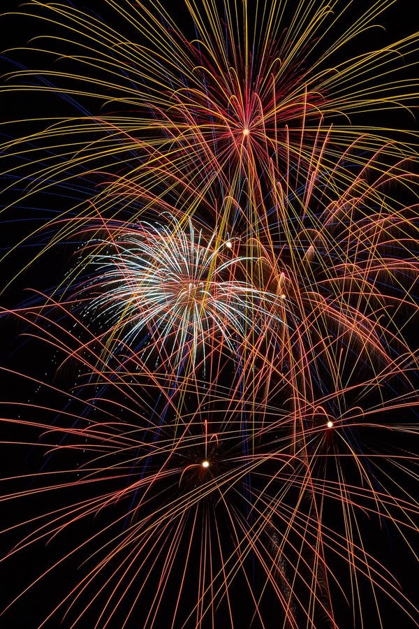 Sparks Fly with Fireworks in the Sky at Night Stock Photo - Image of ...
