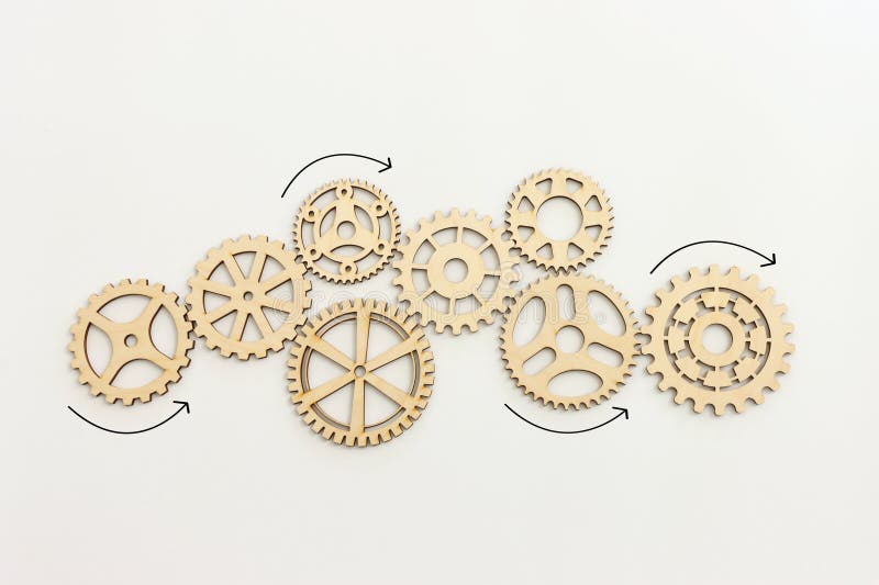 Image of Spinning Gears on a White Background Stock Photo - Image of ...