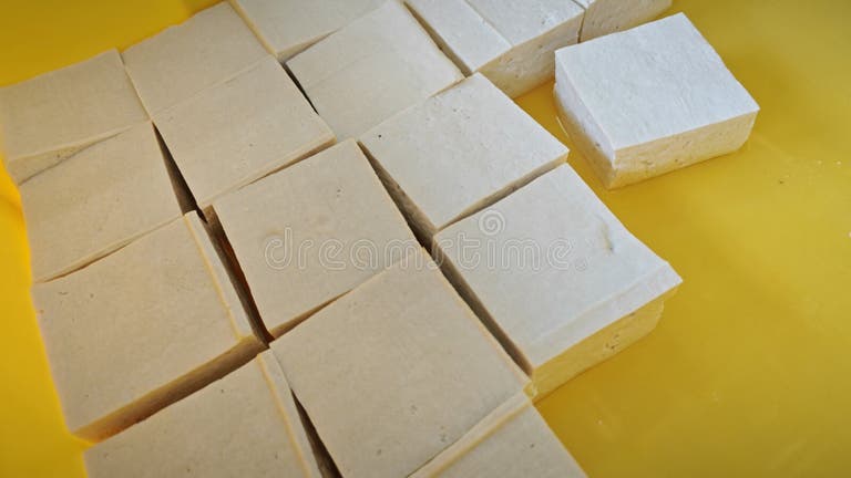 Square-shaped Soft Solid White Tofu Blocks in the Yellow Plastic Tray ...