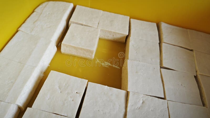 Square-shaped Soft Solid White Tofu Blocks in the Yellow Plastic Tray ...
