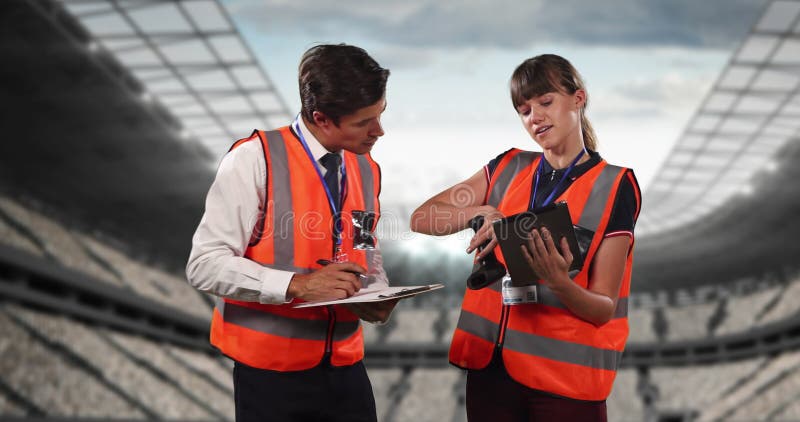 Image of Stadium Over Caucasian Male and Female Workers Talking and ...