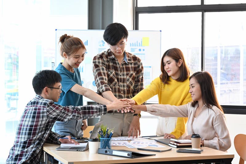 Image of Start Up Business Team Stacking Hands Together in Meeting Room ...