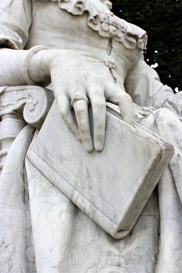 An Image of a Statue with a Book in His Hand Stock Image - Image of ...