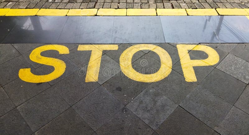 An Image of Stop Sign on the Floor in Front of a School Stock Photo ...