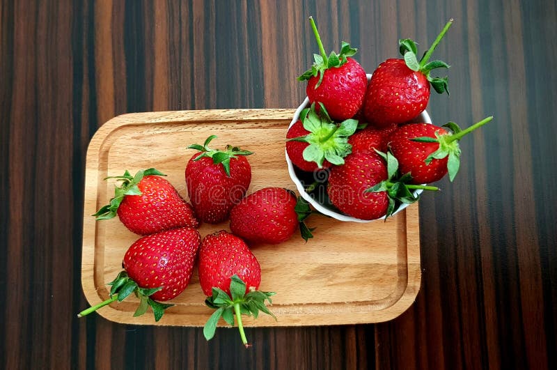 Strawberries on Wood Cutting Board Stock Photo - Image of citrus, light ...