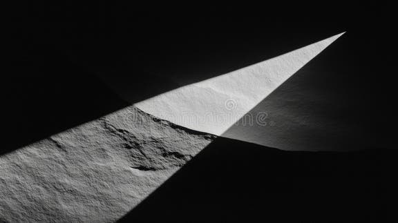 A Black and White Photograph of a Triangular Light Source Casting a ...