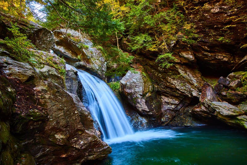 Stunning Waterfall into Gorge Surrounded by Rocks in Early Fall Stock ...