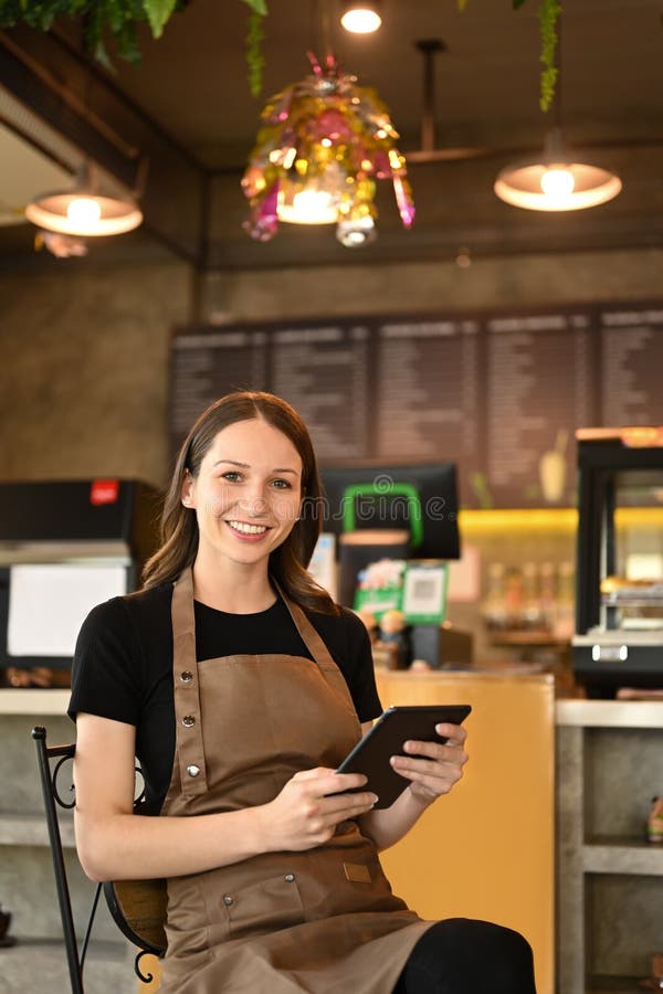 Image of Successful Small Business Owner Using Digital Tablet and ...