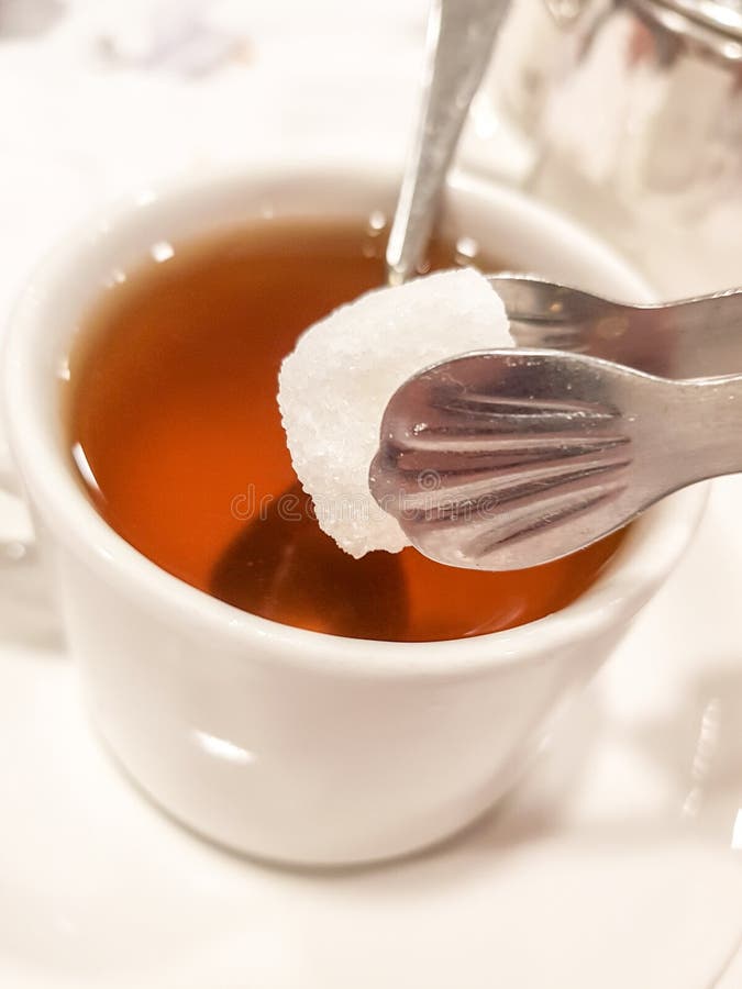 Image of a Sugar Cube Ready To Serve in the Tea Cup Stock Photo - Image ...