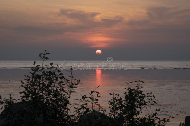 Sunset during Low-tide at the Beach. Stock Image - Image of beach ...