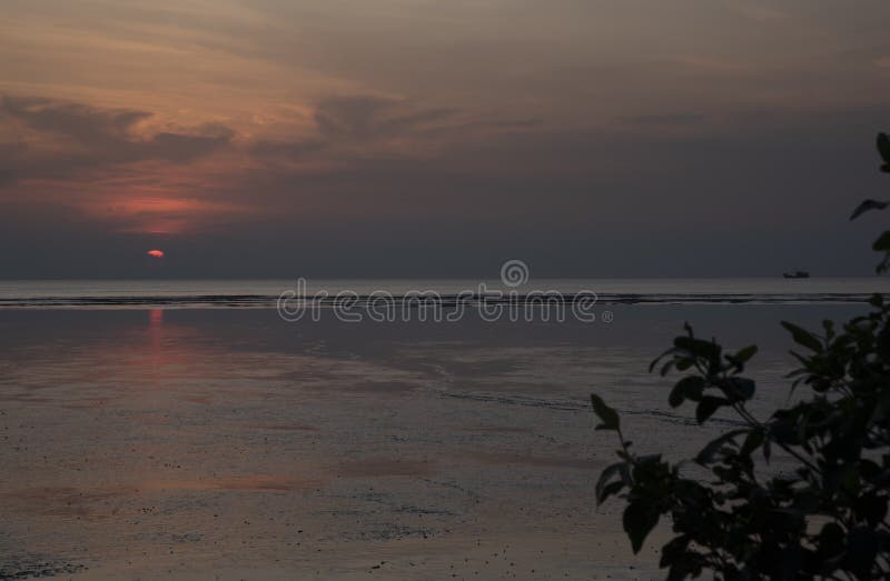 Sunset during Low-tide at the Beach. Stock Image - Image of cloud ...