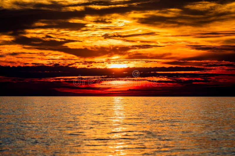 Image of a Sunset in the Yellow Sky from the Sea. Stock Image - Image ...